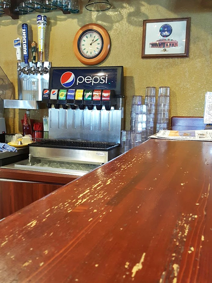 The beverage station offers a practical reminder that even the most divine green chili occasionally requires something to cool the enthusiasm on your taste buds.