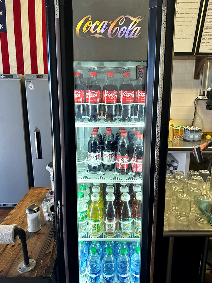 A rainbow of bottled refreshments standing at attention, waiting for their moment to shine alongside your sandwich selection.