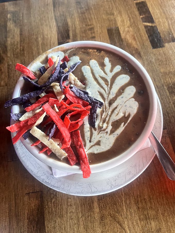 Tomato soup elevated to art form with a creamy swirl and colorful tortilla strips&mdash;the perfect sandwich-dunking medium.