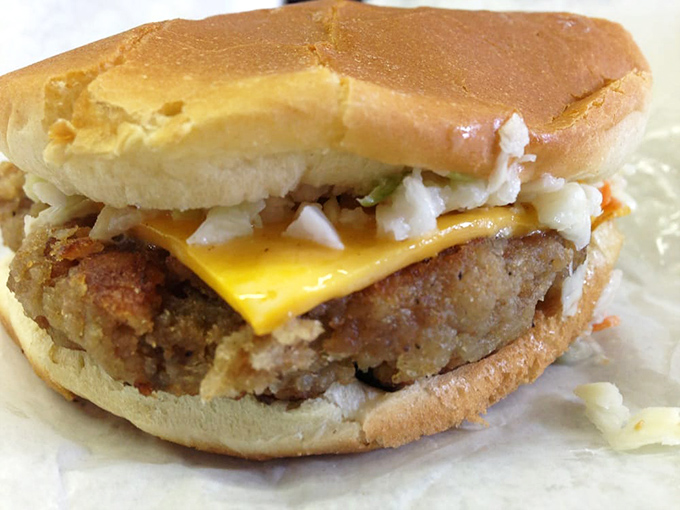 Not just a burger but a statement - breaded, cheese-topped, and defying the laws of sandwich physics.