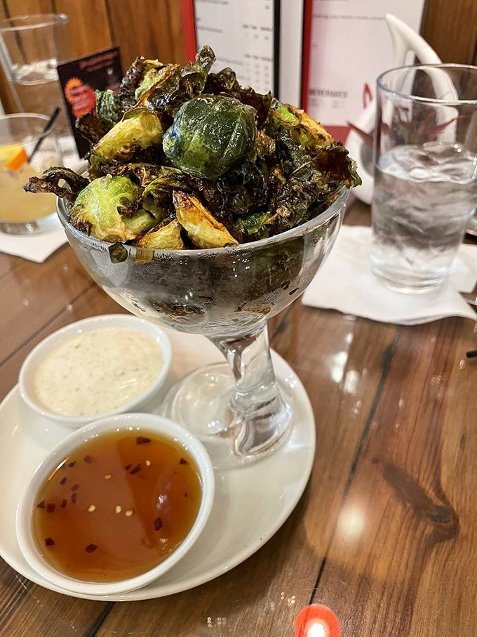 Brussels sprouts that have undergone a spectacular makeover&mdash;crispy, glistening, and served in a martini glass because they're fancy now.