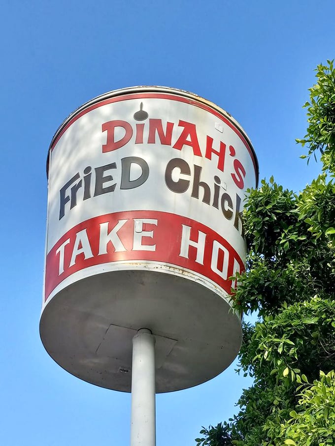 This vintage bucket sign towers above like a mid-century monument to fried chicken excellence&mdash;they literally put their specialty on a pedestal.