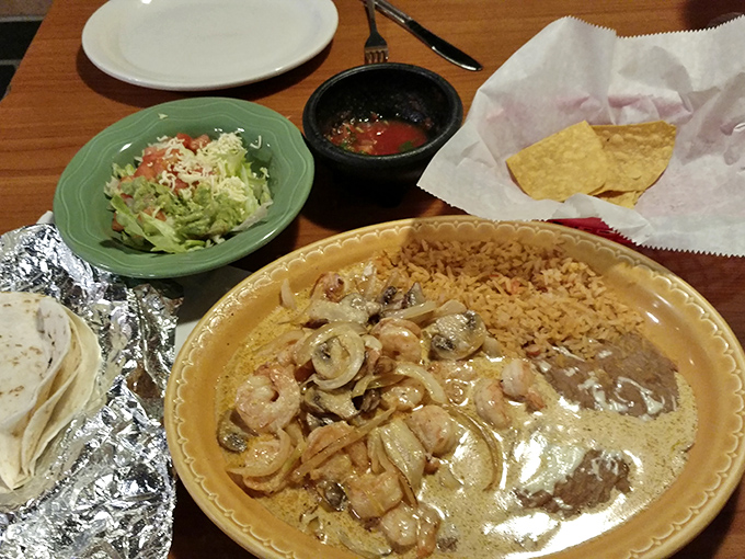 Camarones swimming in a creamy sauce with saut&eacute;ed onions and mushrooms. Seafood this good in Michigan? The Great Lakes just got jealous.