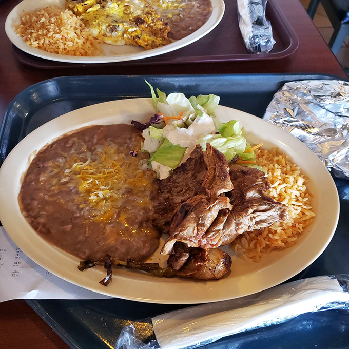 A carne asada plate that means business&mdash;tender grilled beef alongside the holy trinity of Mexican sides: rice, beans, and a fresh salad.