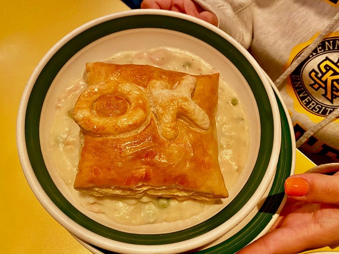 This chicken pot pie wears its "OK" brand proudly, a golden pastry crown floating atop a creamy sea of comfort.