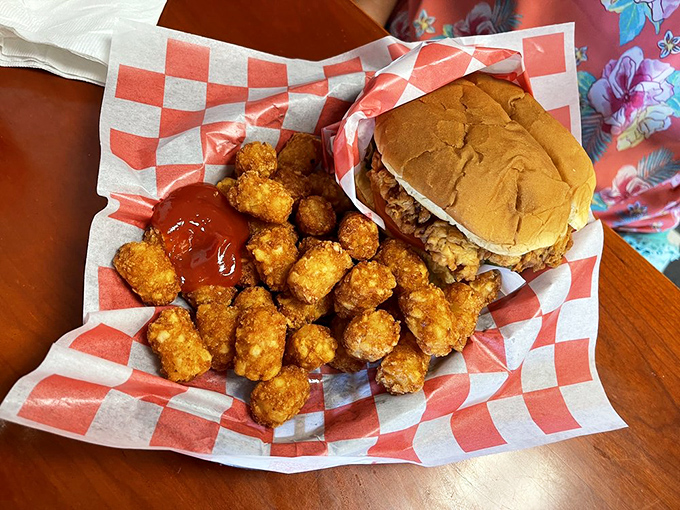 A chicken sandwich with attitude and tater tots that look like they've been fried by someone who truly understands potatoes.