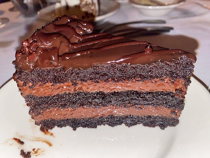 This chocolate cake isn't just dessert—it's layer upon layer of cocoa commitment that makes diets seem like a terrible historical mistake.