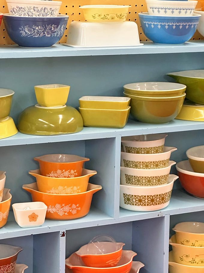 Pyrex paradise! These colorful dishes survived thousands of potlucks and holiday dinners. The patterns are practically a timeline of American home cooking.