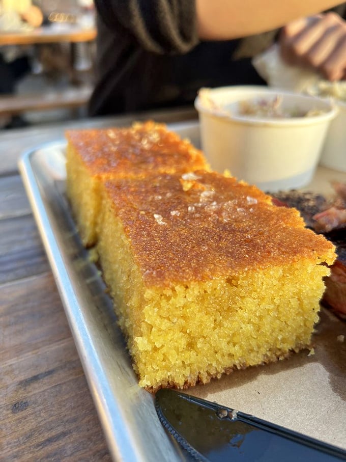Cornbread so golden it practically radiates its own sunshine &ndash; crisp-edged, tender-centered, and ready to soak up every last drop of sauce.
