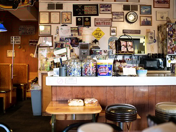 The counter area&mdash;part command center, part community hub&mdash;where diner magic happens beneath decades of collected memories.
