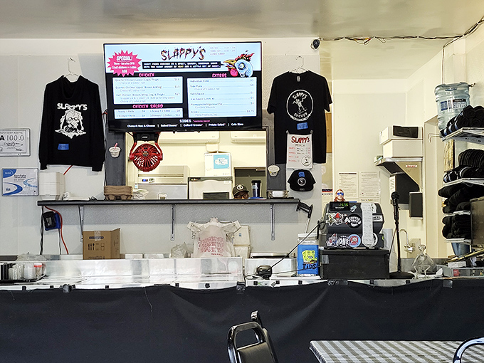 Behind this counter, chicken alchemy happens daily. Those t-shirts aren't just merch&mdash;they're badges of honor for true believers.