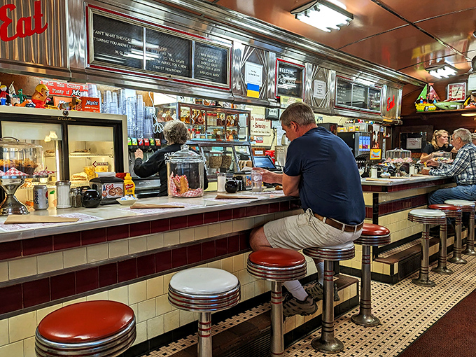 The counter&mdash;where regulars become family and first-timers become regulars. Watch short-order magic happen while perched on those iconic red stools.