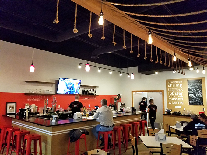 The bar area: where seafood enthusiasts perch like seagulls, eagerly awaiting their treasures from the deep. Minus the annoying squawking.