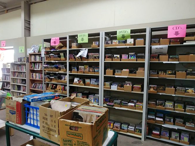 Entertainment for days with neatly organized DVDs, CDs, and vinyl &ndash; a nostalgic treasure trove in our streaming-obsessed world.