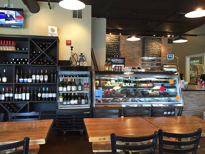 Part deli counter, part wine shop, all wonderful. That display case showcases edible treasures while the chalkboard menu promises adventures your taste buds haven't even imagined.