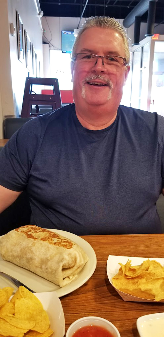 The universal expression of someone who's just discovered their new favorite restaurant. That smile says more than any review ever could.