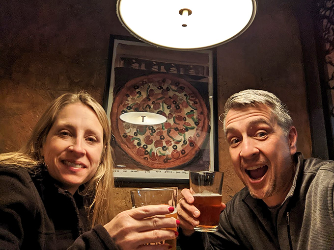 The universal expression of pizza happiness. When the food makes you smile this big, words become entirely optional.