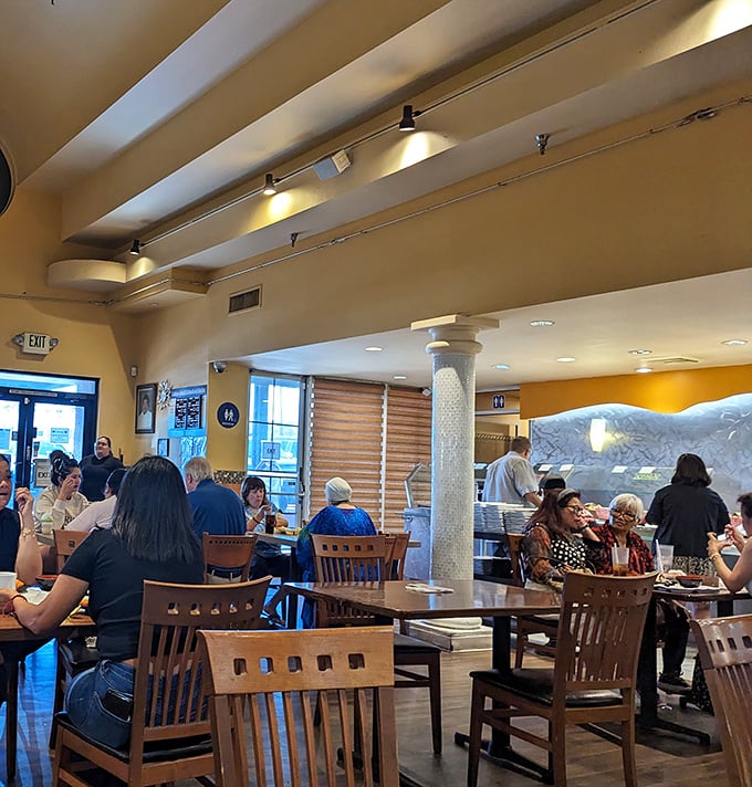 Happy diners enjoying the fruits of their buffet strategy. Notice the focused expressions &ndash; these folks are professionals at the all-you-can-eat game.