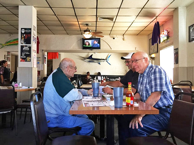 Where regulars become family and first-timers become regulars. The marlin on the wall has seen it all.