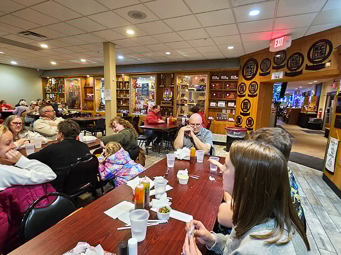 Families gather around tables like modern tribes, united in the ancient ritual of breaking bread and sharing smoked meat.