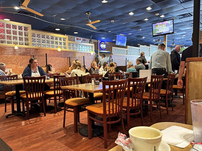 A dining room filled with regulars who know the secret. Notice how nobody's looking at their phones? The food commands full attention.