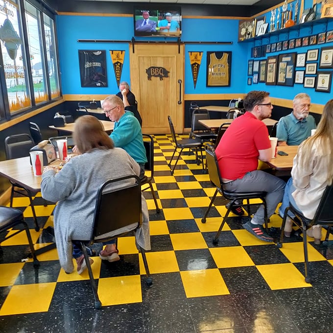 The black and yellow checkerboard floor isn't just decoration – it's a warning that your taste buds are about to experience checkmate.