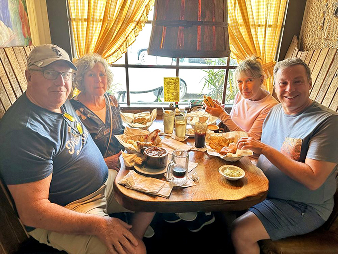 Happy diners caught in the middle of that universal moment&mdash;when the food arrives and conversation momentarily surrenders to pure enjoyment.