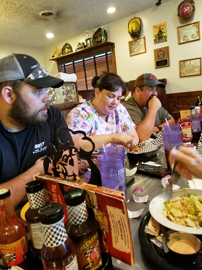 The universal language of barbecue brings people together. That focused concentration is the face of people experiencing true culinary joy.