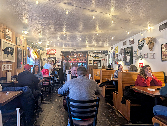 The dining room hums with the universal language of barbecue appreciation&mdash;string lights overhead and satisfied smiles below.