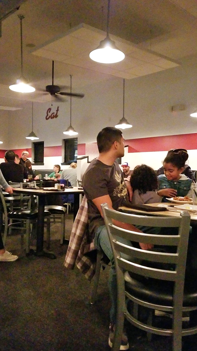 A bustling dining room where strangers become friends, united by the universal language of "mmm" and "pass the napkins, please."