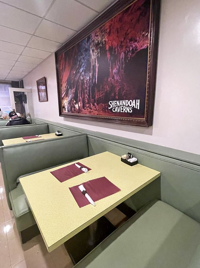 Booths upholstered in that particular shade of mint green that somehow makes everything taste more authentic, under the watchful gaze of Shenandoah Caverns.