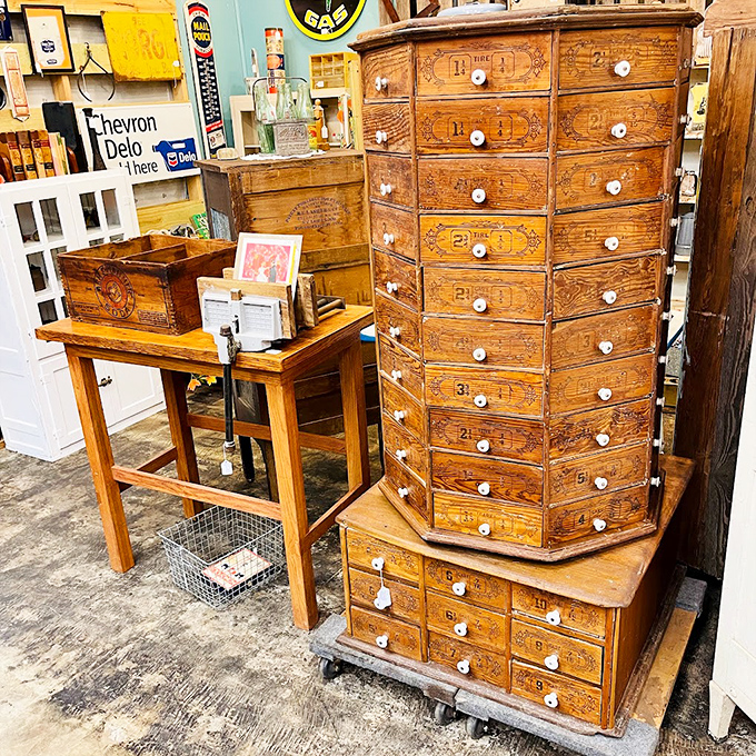 This multi-drawer cabinet once organized someone's hardware store but now stands as a monument to craftsmanship that modern furniture can only dream of matching.
