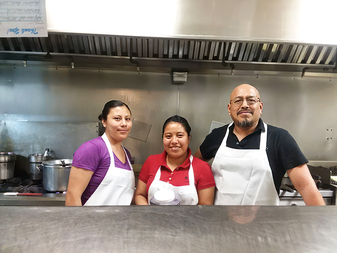 The kitchen team&mdash;the unsung heroes whose hands craft those legendary plates. Their smiles suggest they know exactly how good their food is.