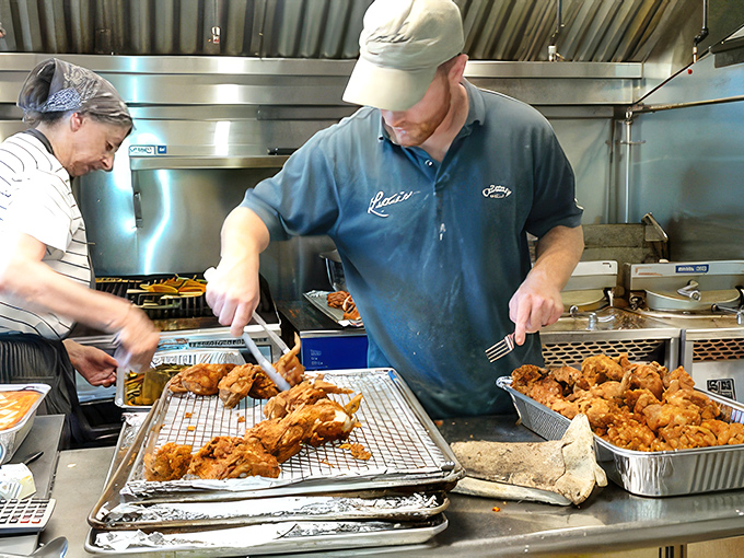 The kitchen crew in their element, transforming simple ingredients into golden-brown works of art that will soon become cherished memories.
