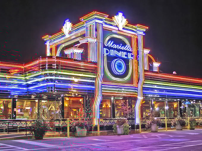 At night, the neon-lit exterior transforms into a carnival of color. Like Las Vegas, if Vegas specialized in meatloaf and milkshakes.
