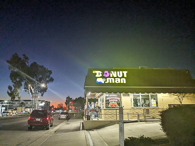 As darkness falls, the glow of The Donut Man sign becomes a lighthouse for the dessert-obsessed. Sweet dreams are made of this.