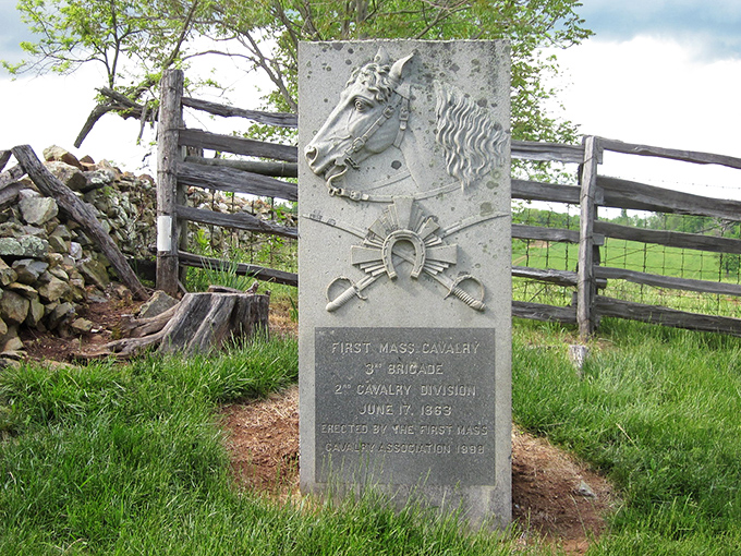 This cavalry monument stands like a sentinel from another era, a stone time capsule amid pastoral tranquility.