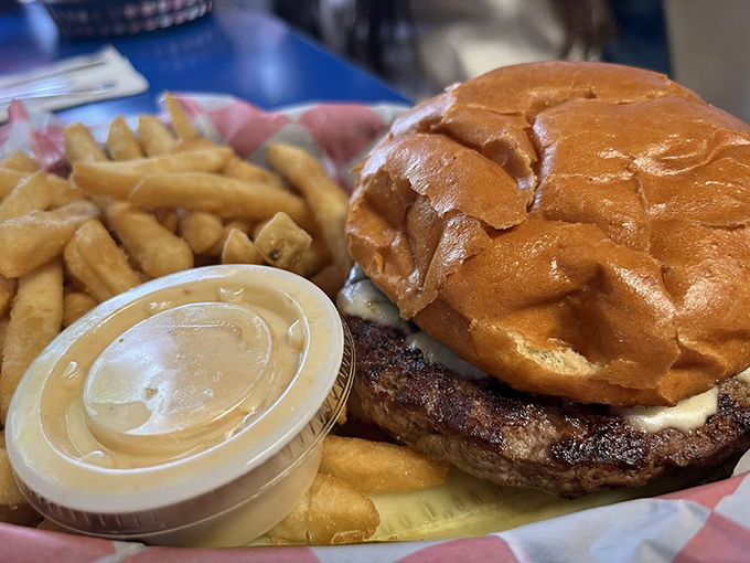 The Flood Bay Burger arrives like a delicious monument to Midwest appetite—proof that Betty's savory game is as strong as its sweet.