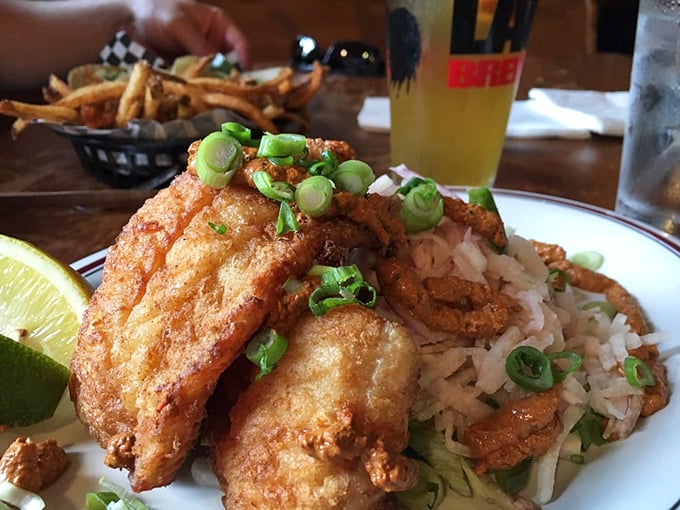 This isn't just fried fish – it's a celebration of texture and flavor, where crispy coating gives way to flaky perfection underneath.