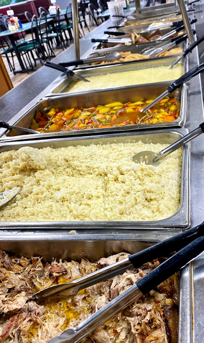 Steam rises from trays of comfort classics. That rice looks fluffy enough to nap on, and the pulled meat below promises savory satisfaction.