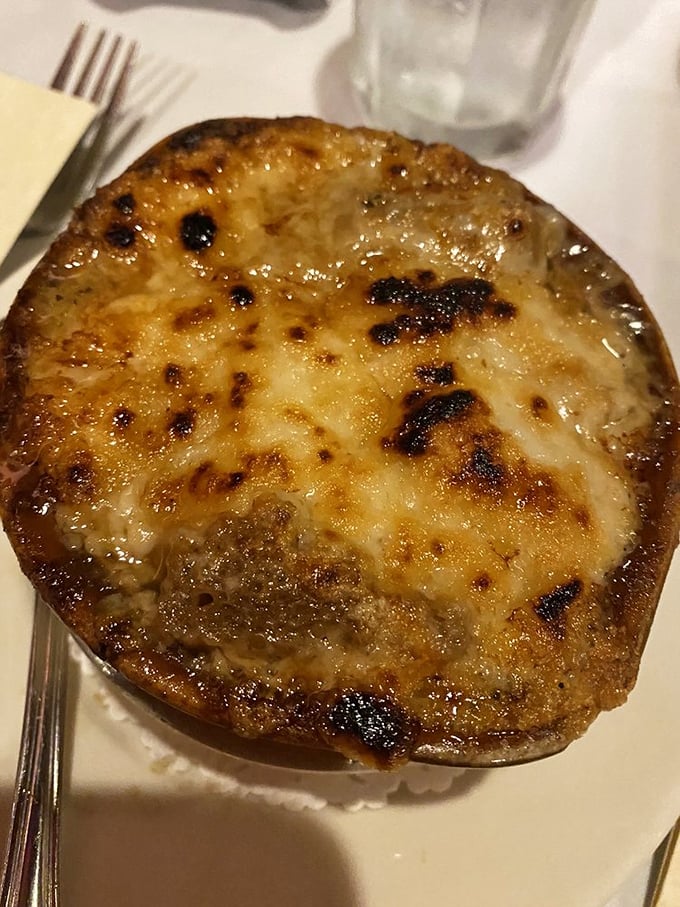 French onion soup that's achieved the perfect cheese-pull-to-broth ratio. That golden crown of broiled cheese is practically begging for a fork's first breach.