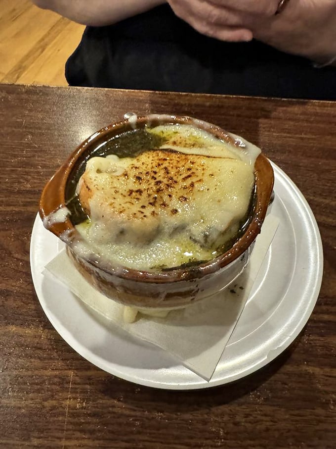 French onion soup that doesn't just sit in the bowl &ndash; it performs, with cheese pulling theatrical stretches with every spoonful.