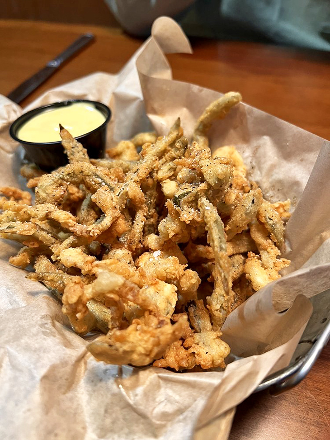 Crispy fried pickles that crunch like autumn leaves, served with a creamy dipping sauce&mdash;the appetizer that ruins friendships when the last one disappears.