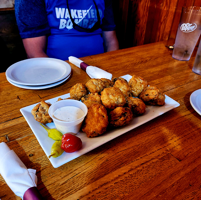 These fried mushrooms aren't just appetizers&mdash;they're golden orbs of happiness that make you momentarily forget you're supposed to save room for the main course.
