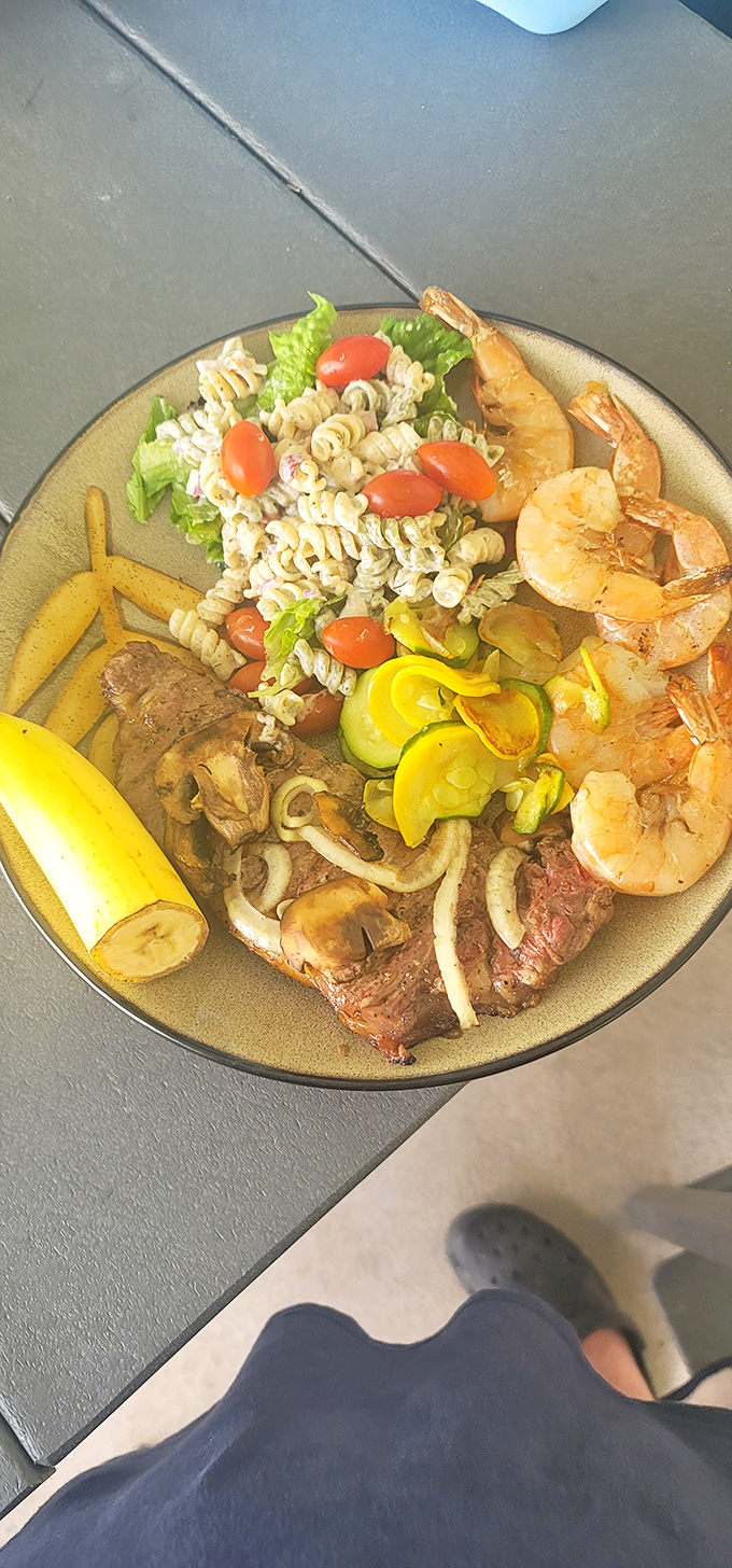 A plate that tells the story of land and sea coming together in perfect harmony. That banana isn't just garnish&mdash;it's the intermission.