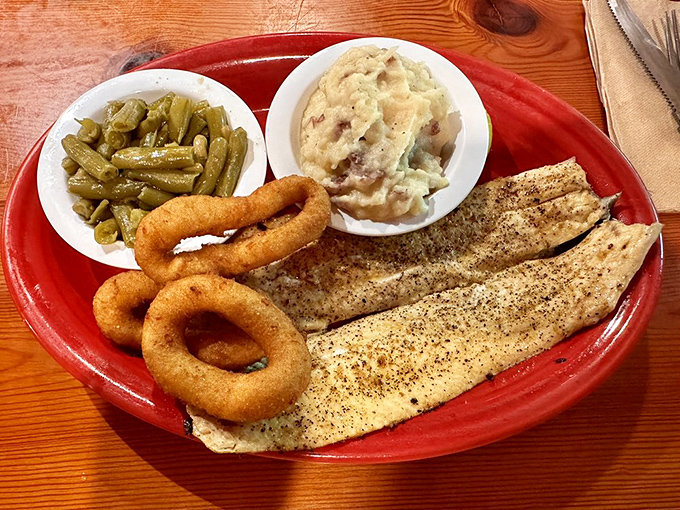 This rainbow trout with onion rings and sides didn't swim upstream just to be ordinary&mdash;it fought its way to flavor glory.