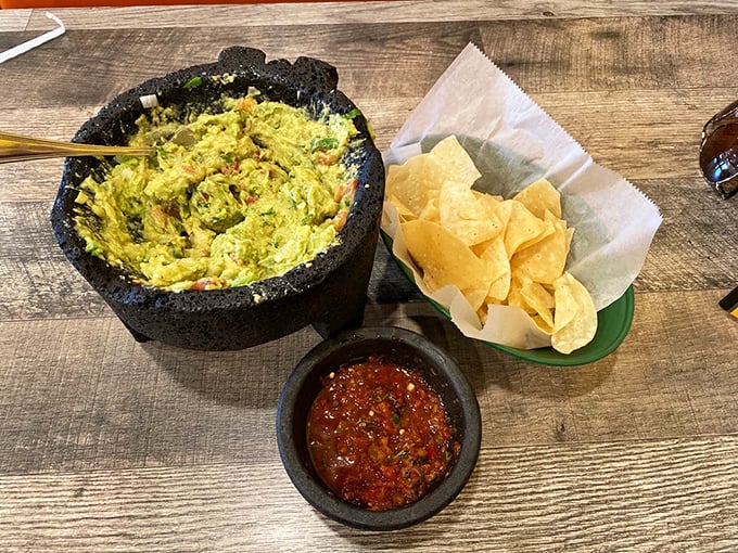 Fresh guacamole served in a traditional molcajete&mdash;where avocados go to fulfill their highest purpose alongside homemade chips and salsa.