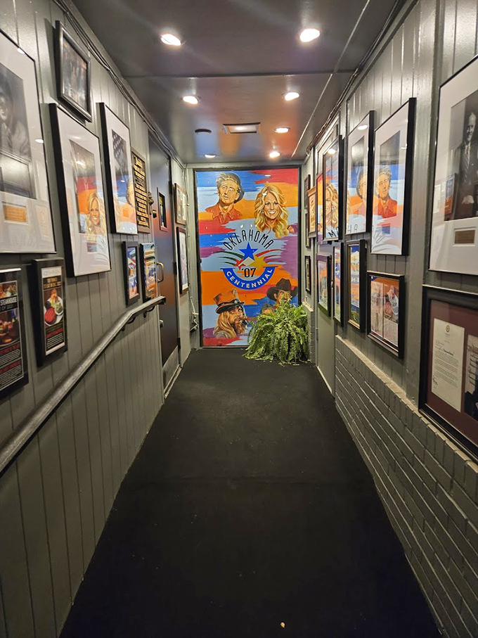 A corridor lined with Oklahoma history leads you deeper into the Jamil's experience, building anticipation with every step.