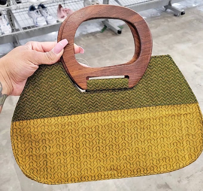 Vintage handbags speak of eras gone by with their distinctive shapes and materials. This wooden-handled beauty combines retro charm with surprising practicality.