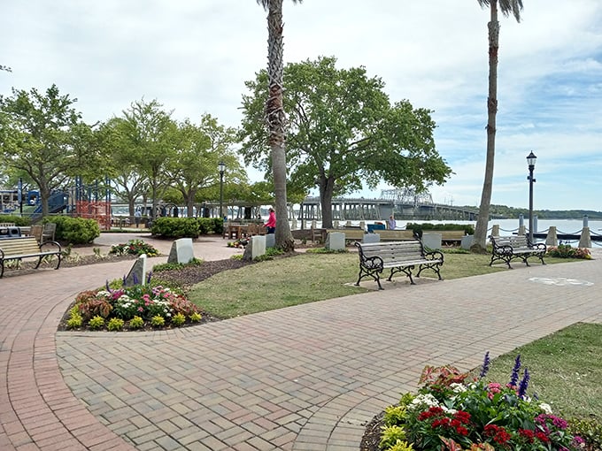 The Waterfront Park's manicured gardens and shaded benches offer respite from exploration, proving Southern hospitality extends even to public spaces.